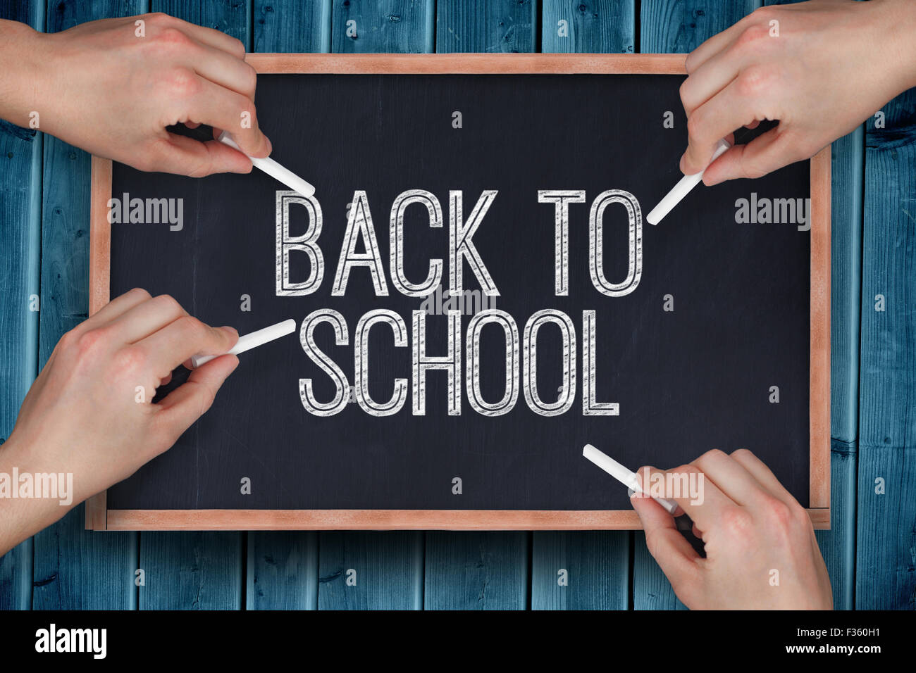 Composite image of multiple hands writing with chalk Stock Photo - Alamy