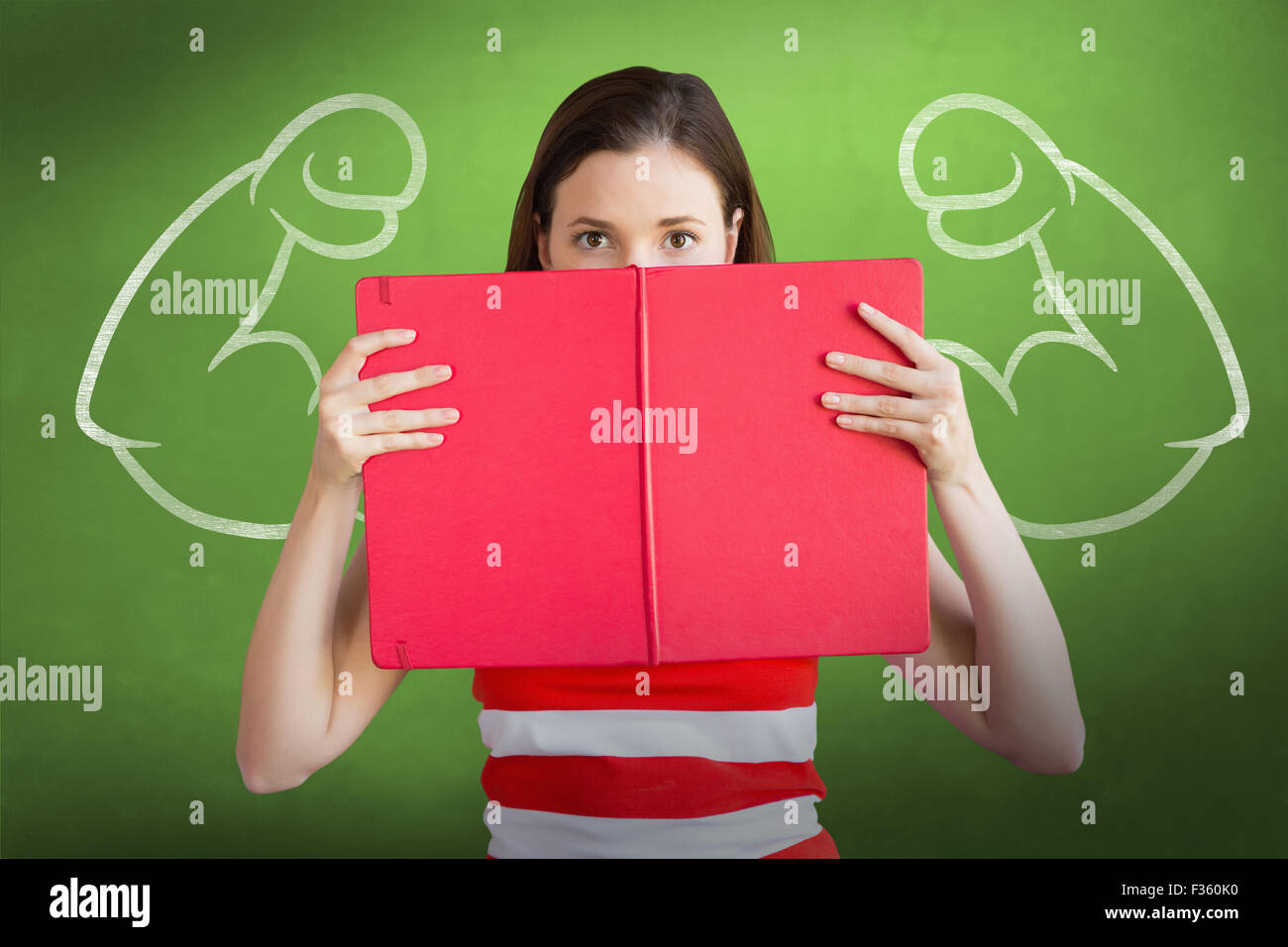 Composite image of student holding book over face Stock Photo - Alamy
