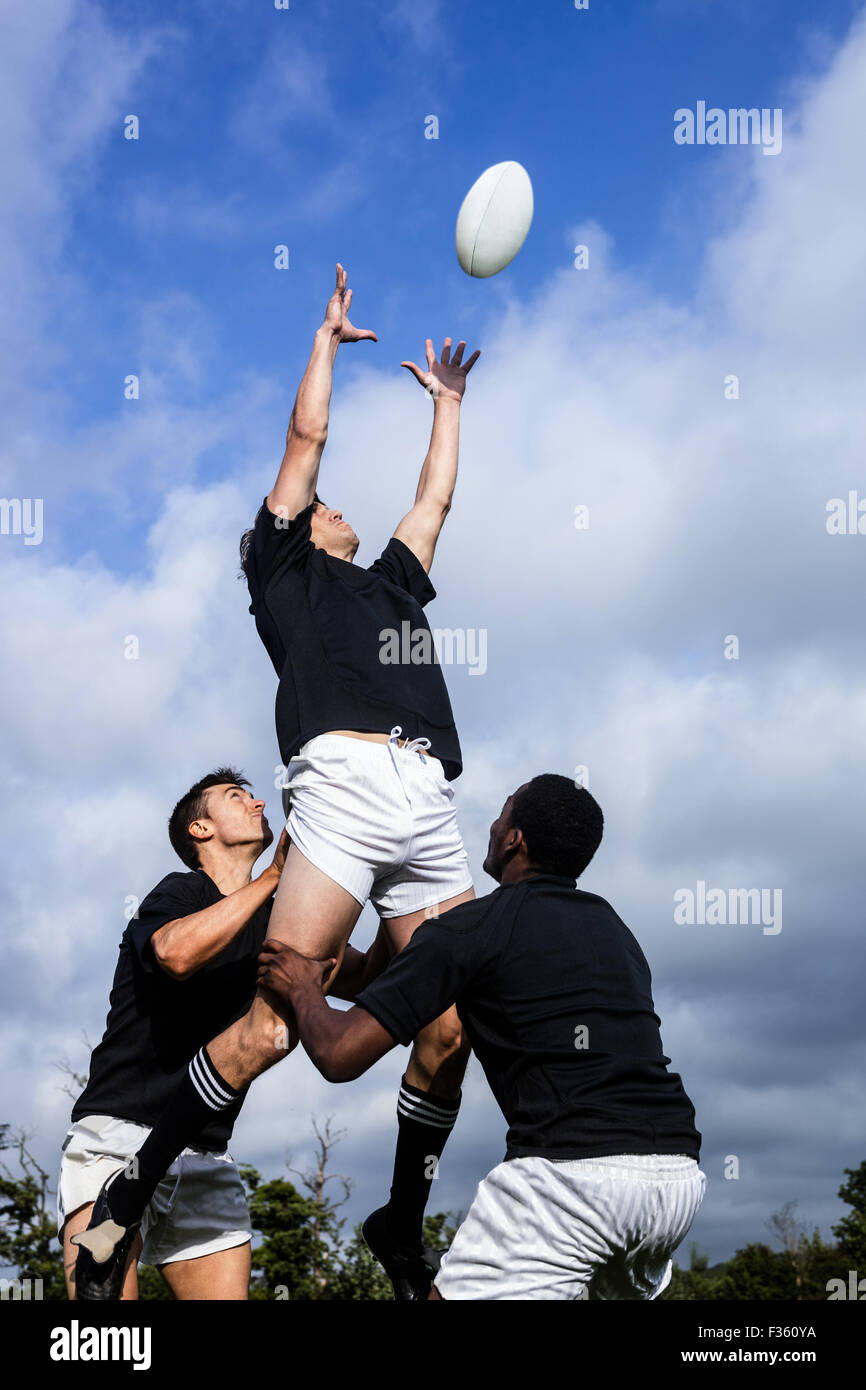 Rugby players jumping for line out Stock Photo - Alamy