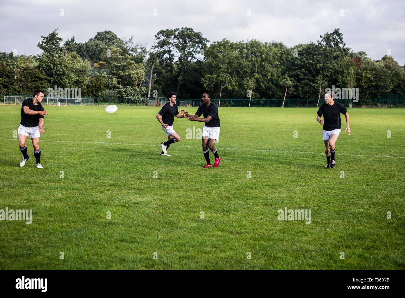 Rugby players training on pitch Stock Photo - Alamy
