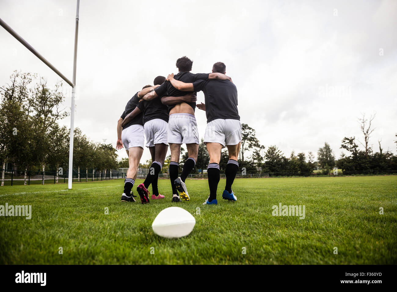 Rugby players training on pitch Stock Photo - Alamy