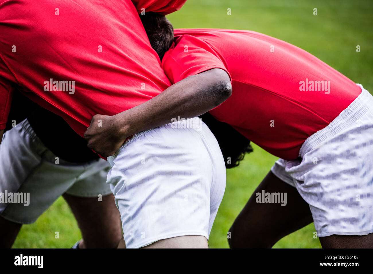 Rugby players doing a scrum Stock Photo - Alamy