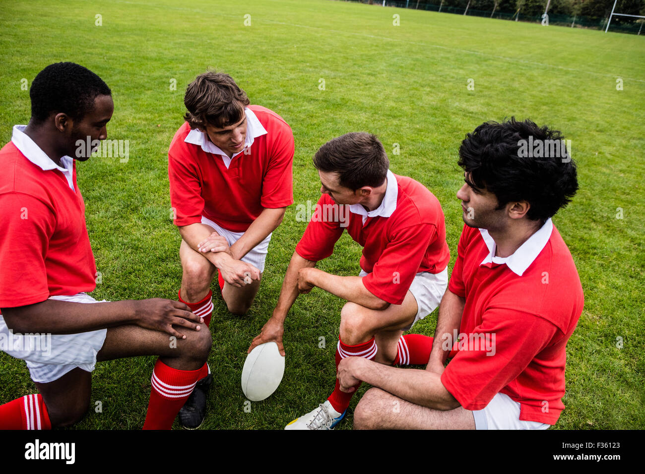 Rugby players discussing tactics before match Stock Photo - Alamy