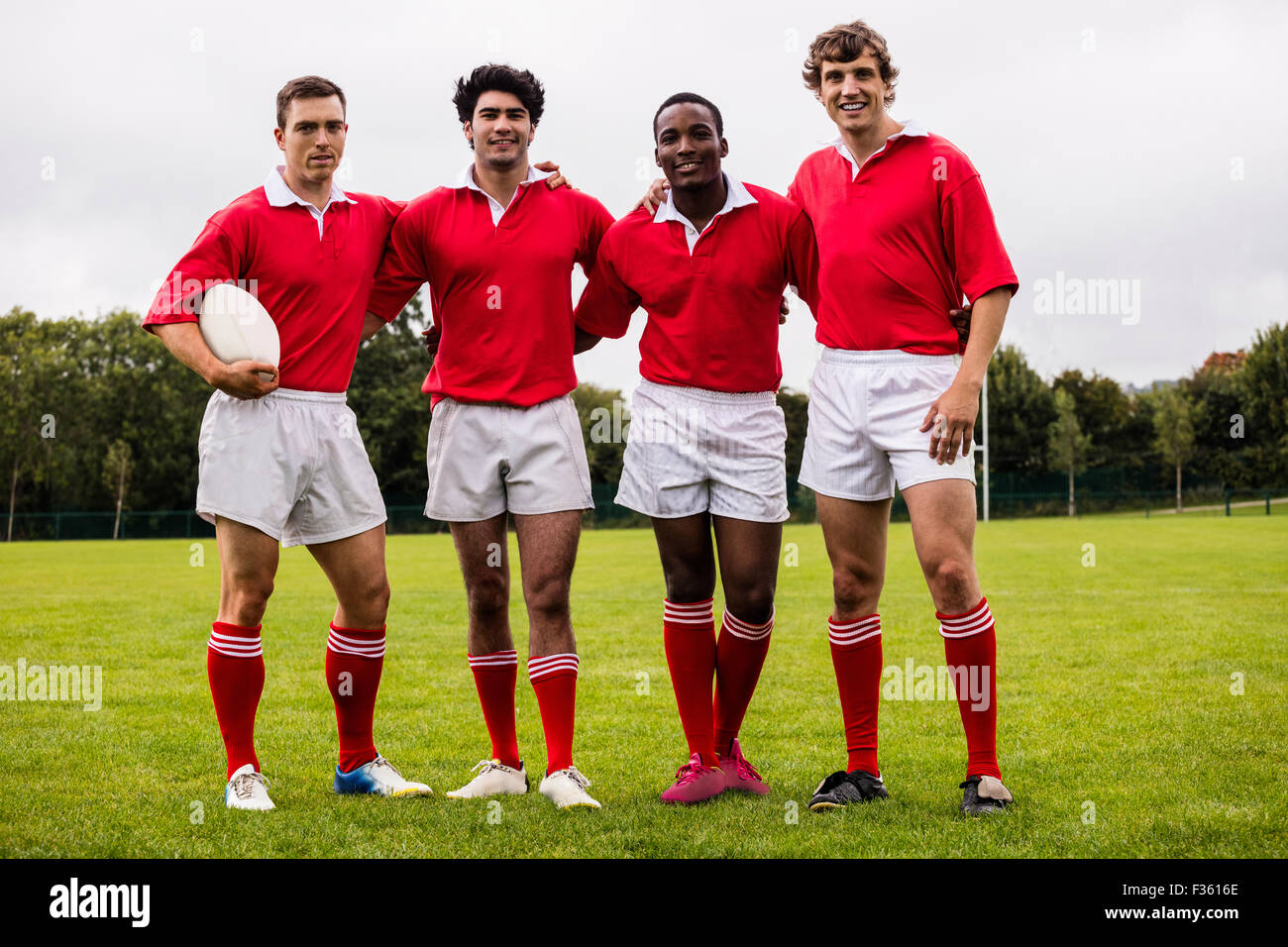 Rugby players smiling at camera Stock Photo - Alamy