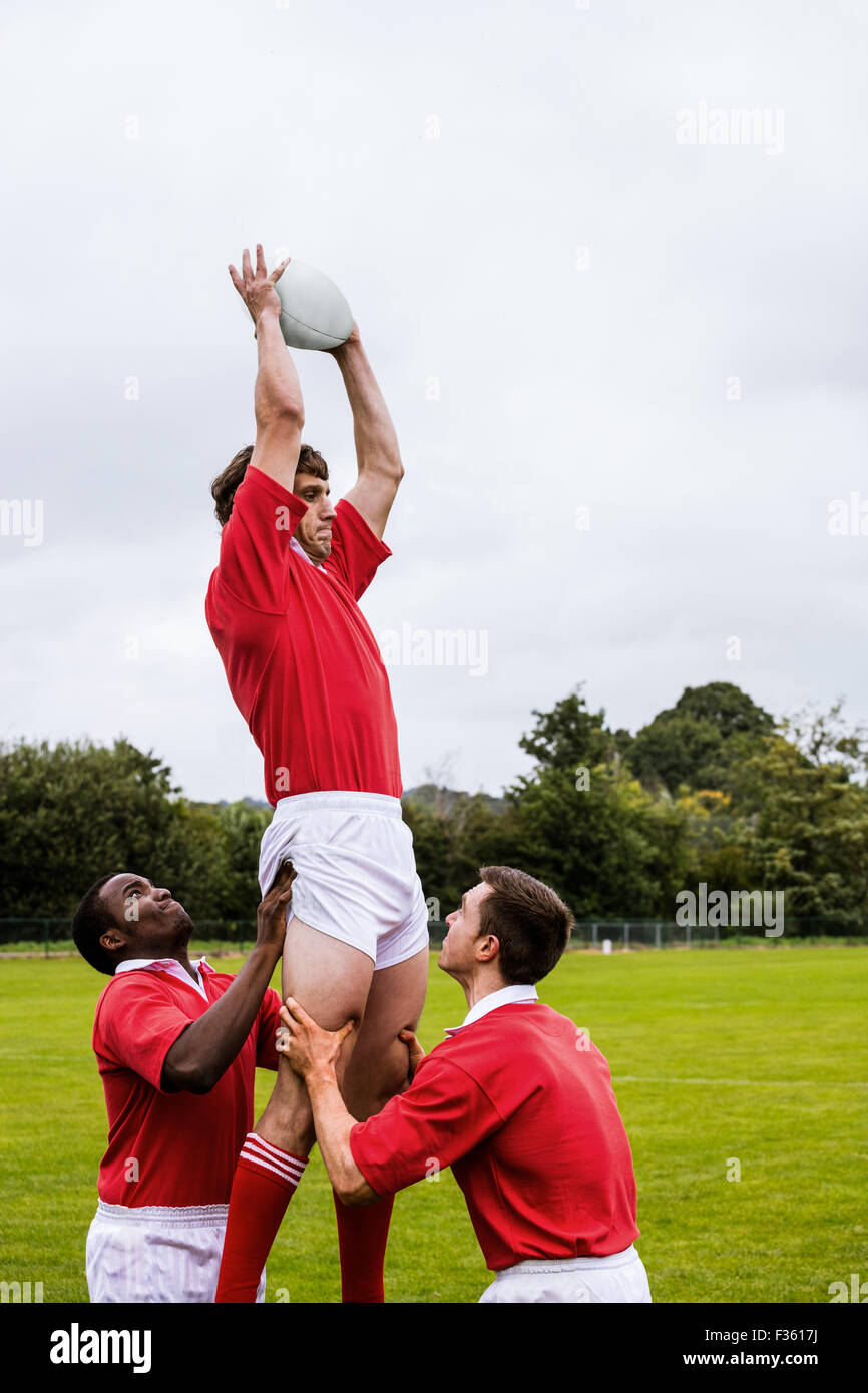 Rugby players jumping for line out Stock Photo - Alamy