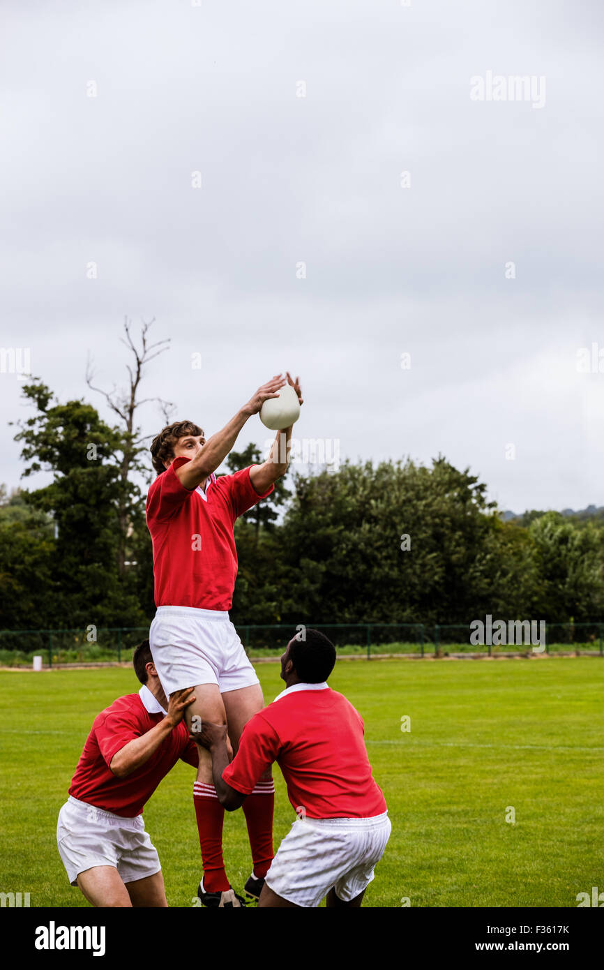 Rugby players jumping for line out Stock Photo - Alamy