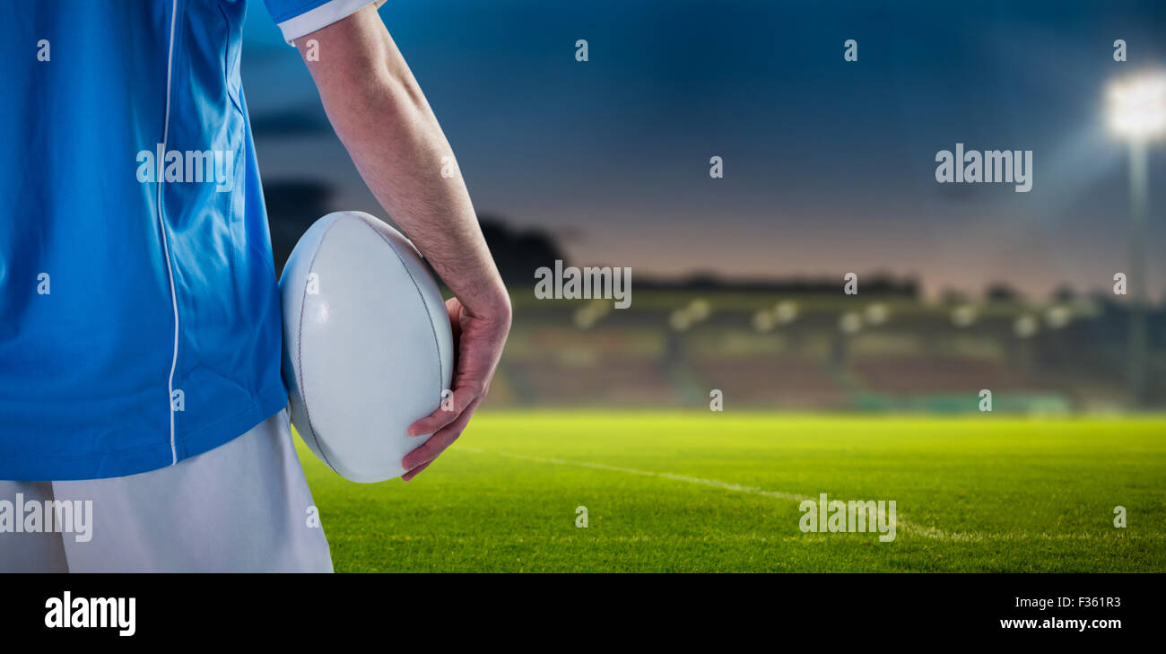 Composite image of serious rugby player with arms crossed Stock Photo ...