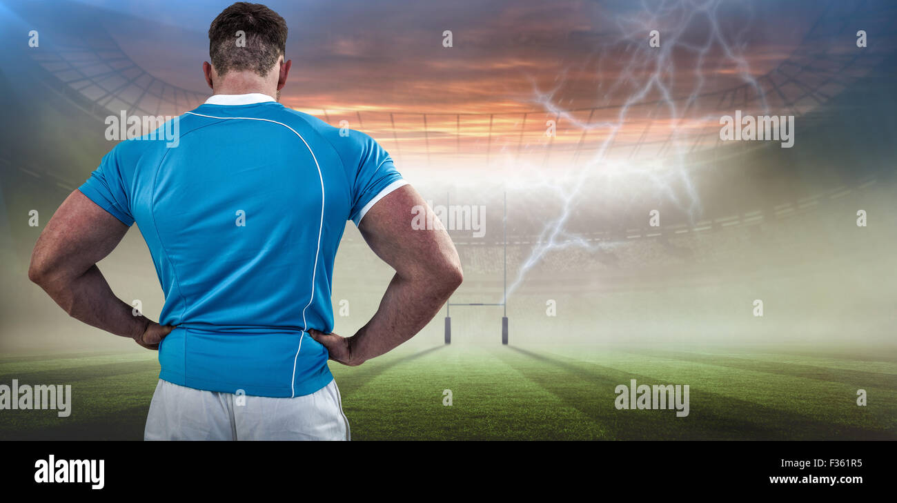 Composite image of rugby player with hands on hips Stock Photo - Alamy