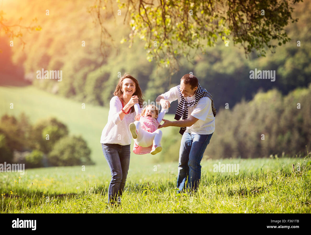Happy family in nature Stock Photo - Alamy