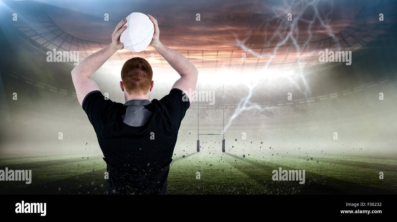 Composite image of rugby player about to throw a rugby ball Stock Photo ...