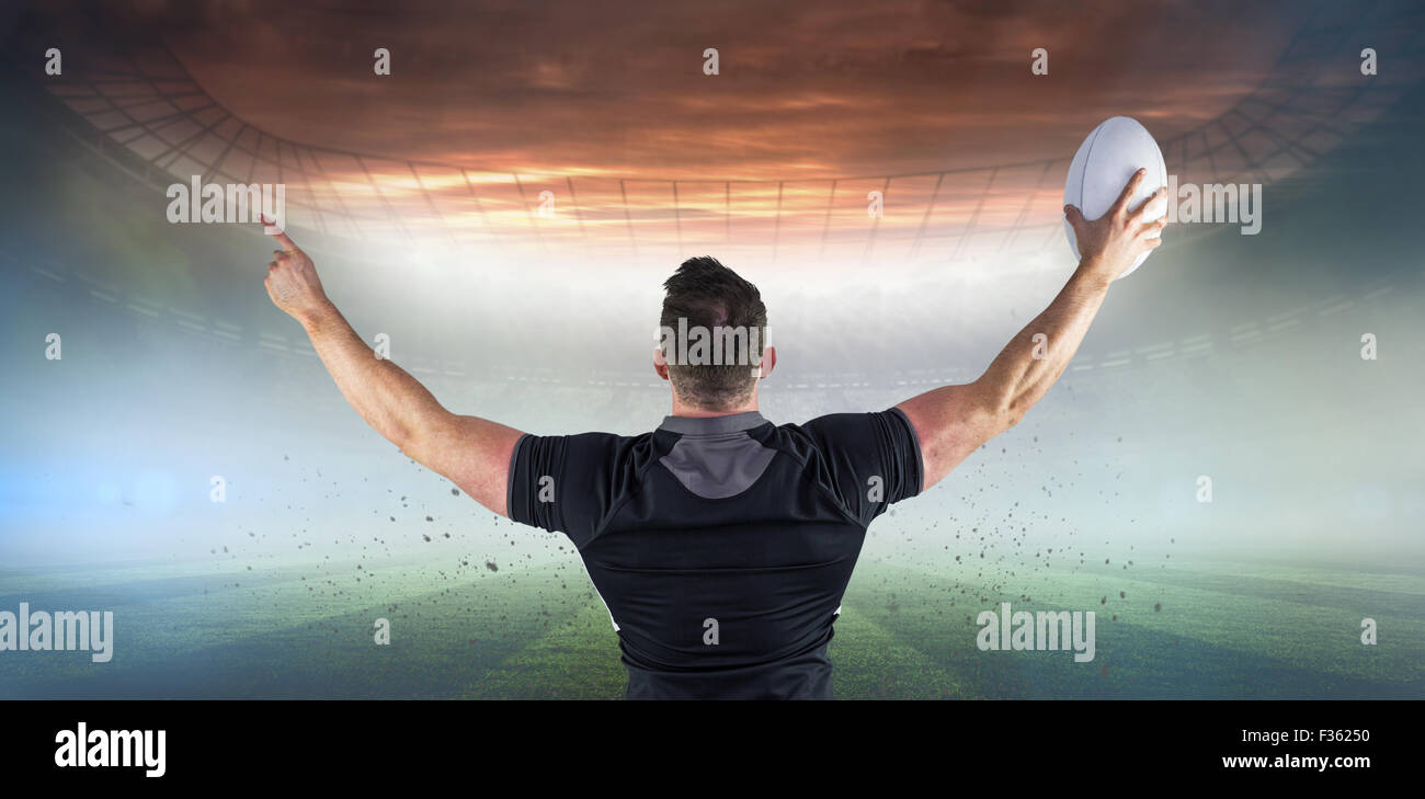 Composite image of rugby player celebrating with the ball Stock Photo ...