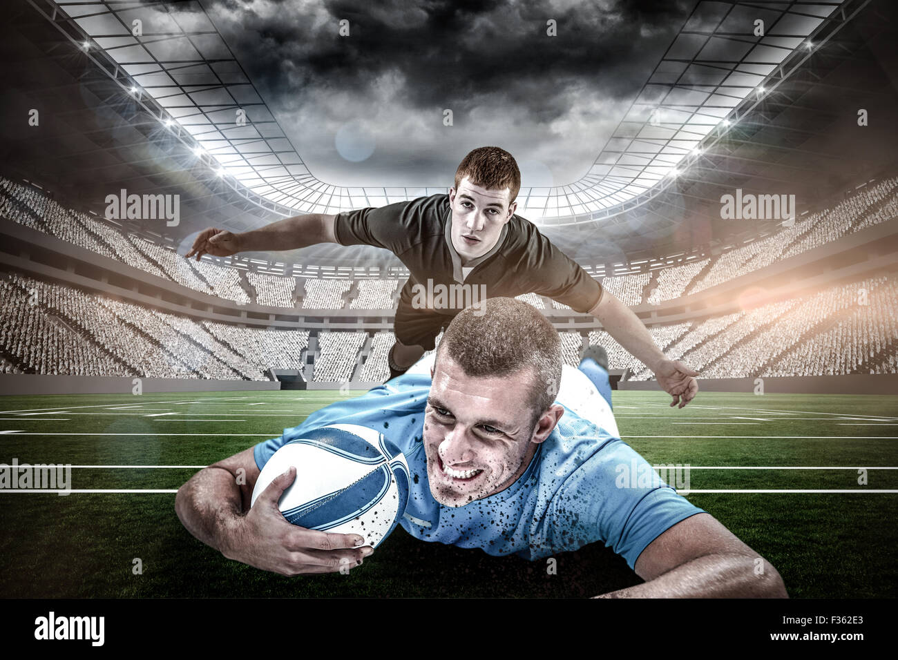 Composite image of confident rugby player lying in front with ball ...