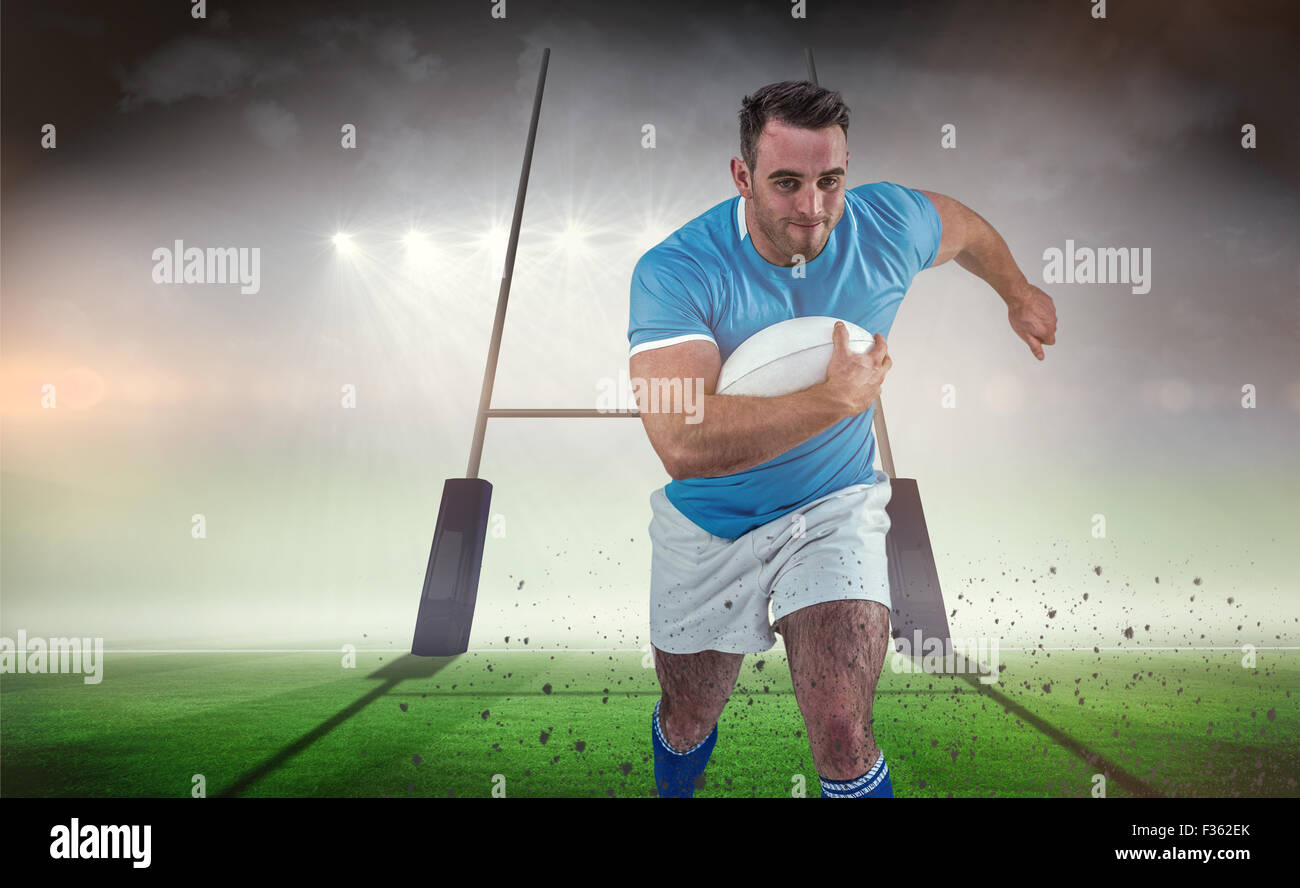 Composite image of rugby player running with the ball Stock Photo - Alamy