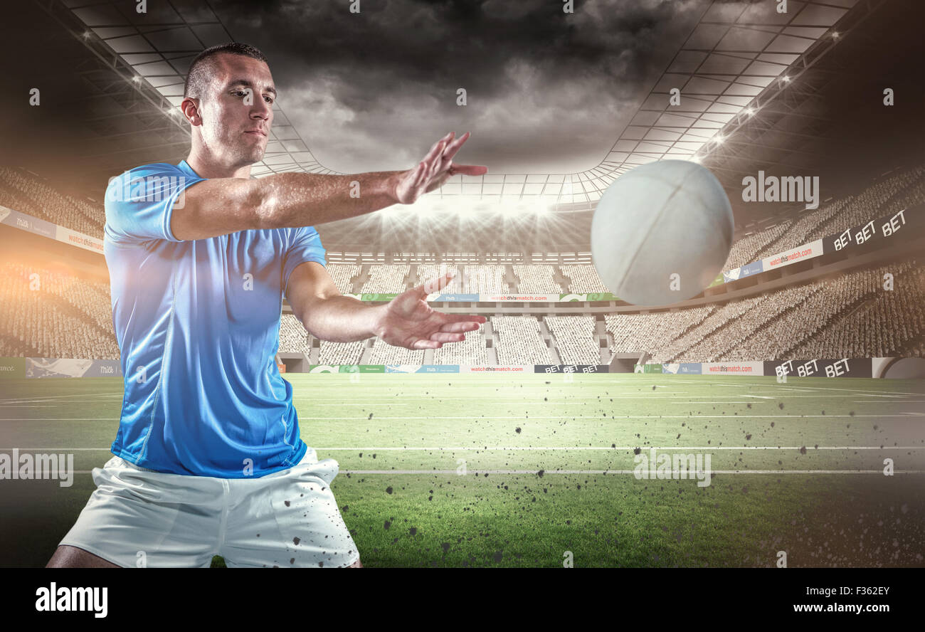 Composite image of rugby player catching the ball Stock Photo - Alamy
