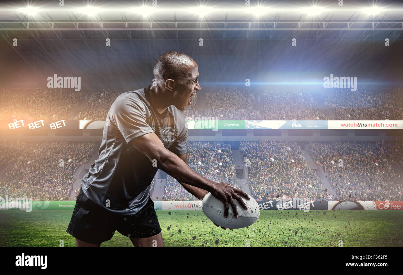 Composite image of sportsman playing rugby Stock Photo - Alamy