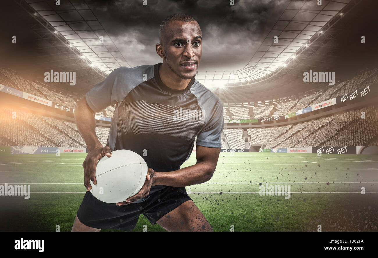 Composite image of rugby player in position to throw ball Stock Photo ...