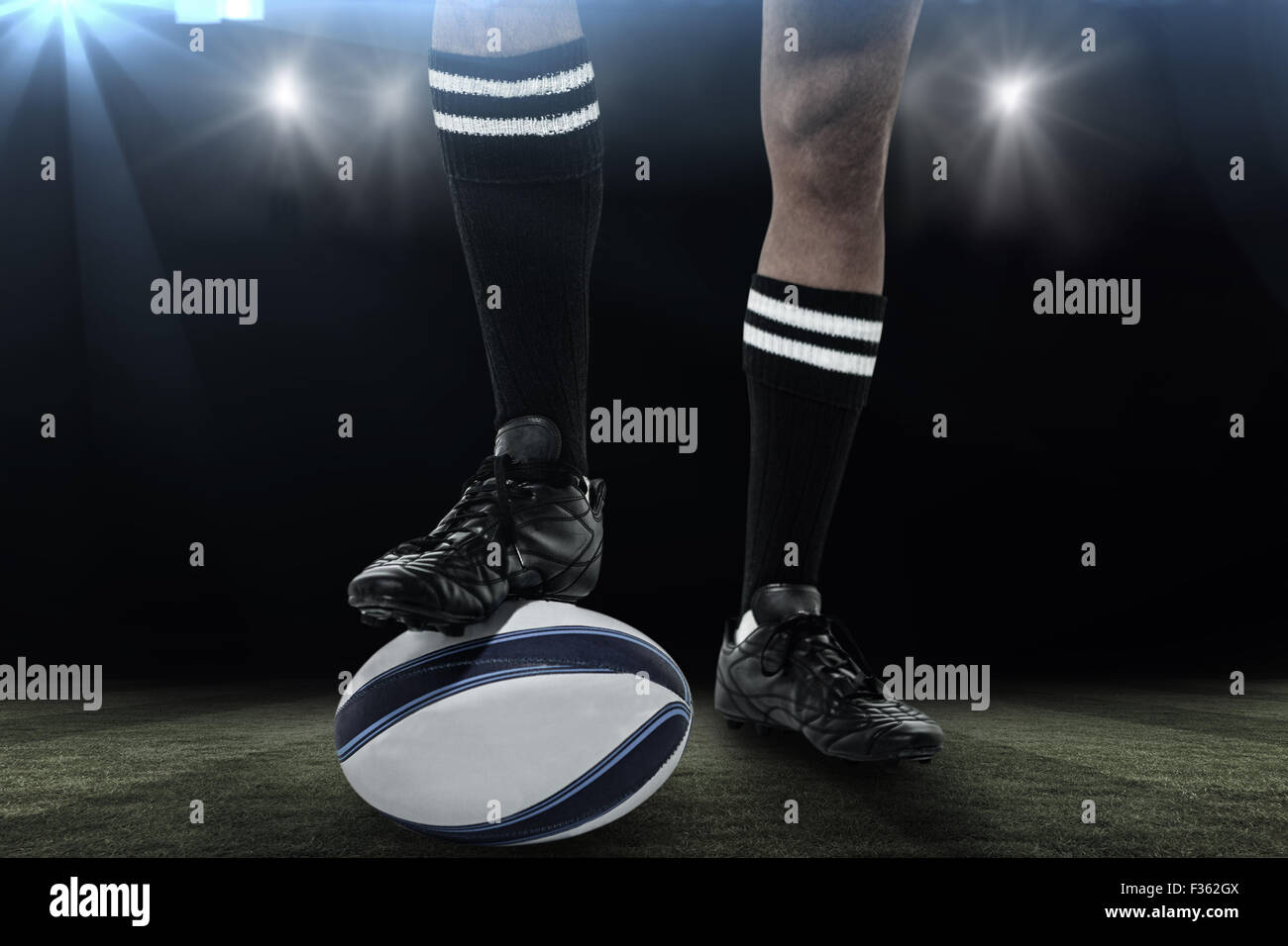 Composite image of rugby player in black socks on ball Stock Photo - Alamy