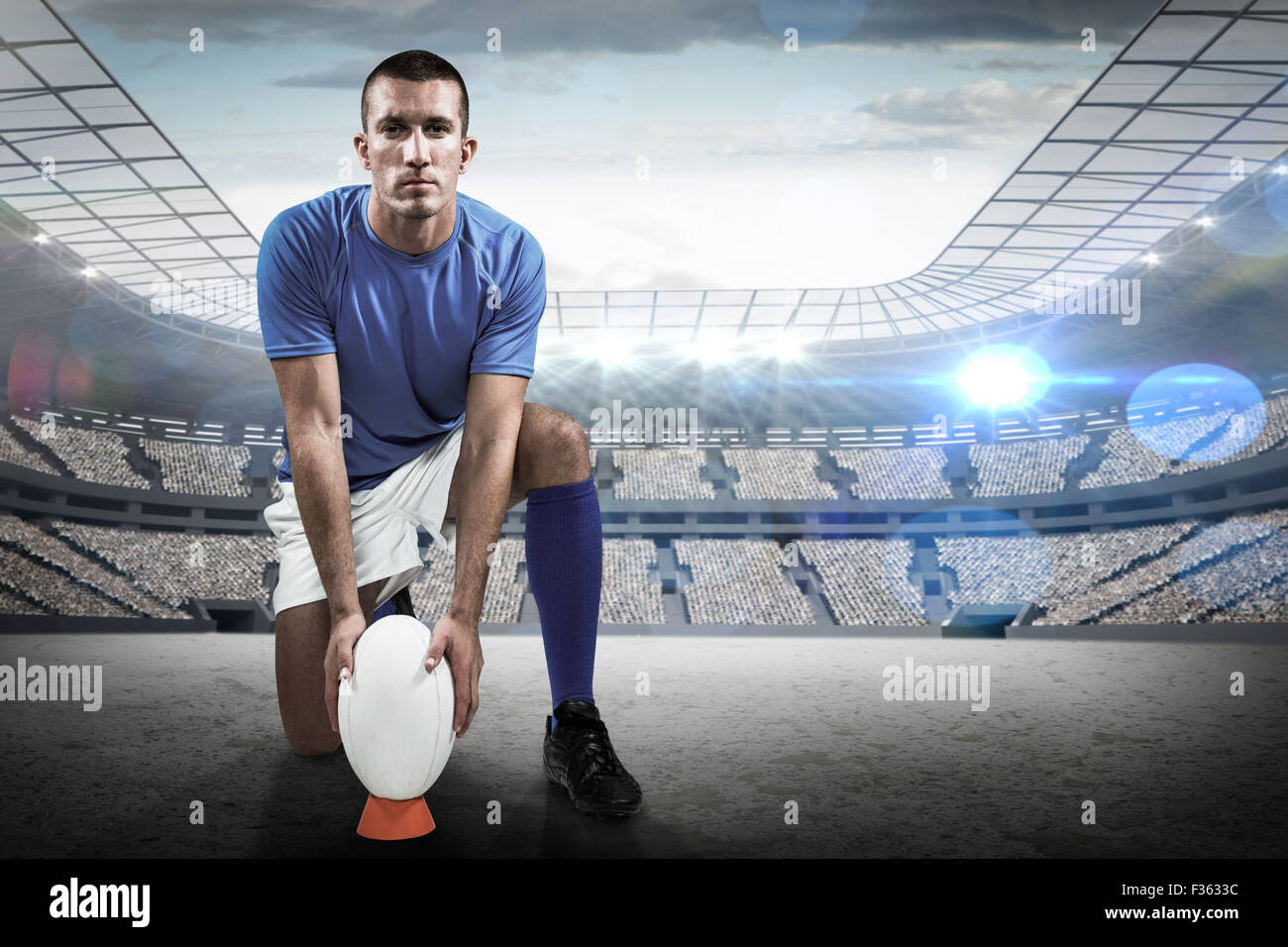 Composite image of full length portrait of rugby player placing ball ...