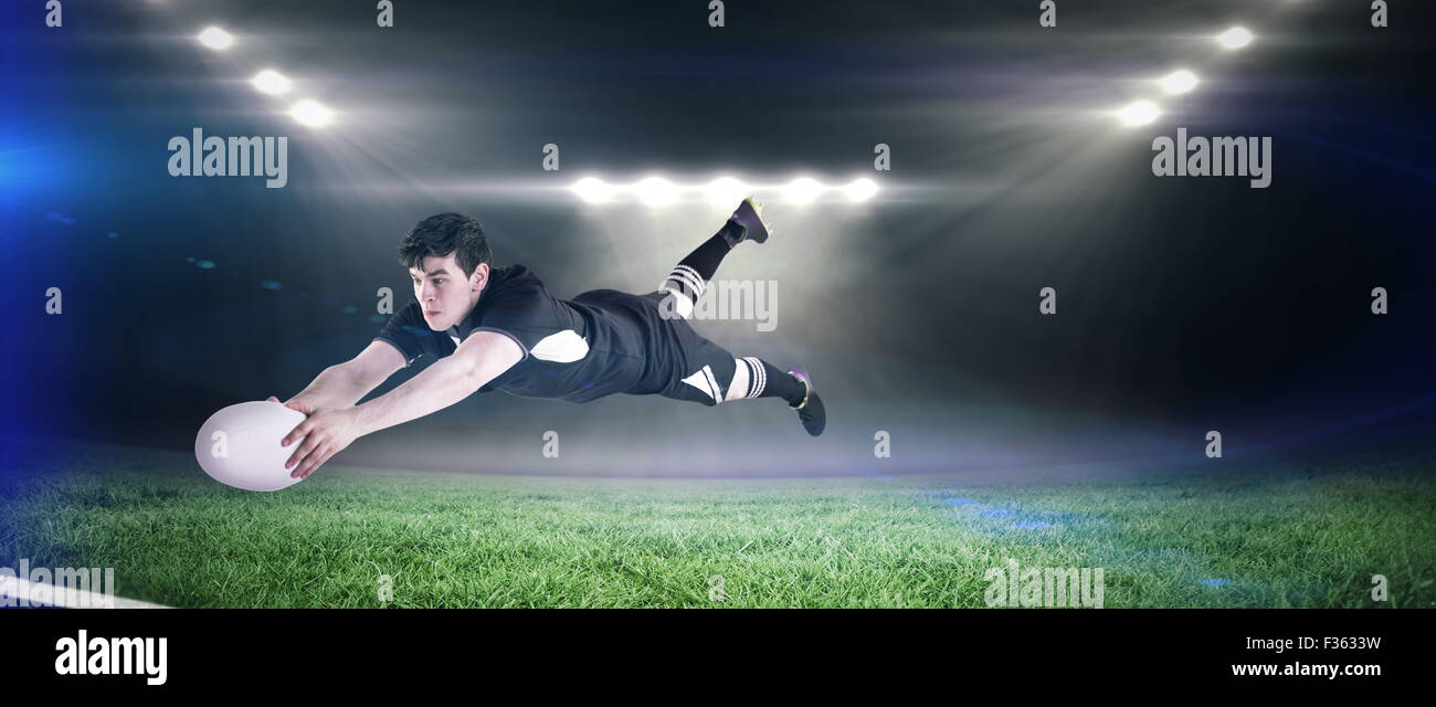 Composite image of a rugby player scoring a try Stock Photo - Alamy