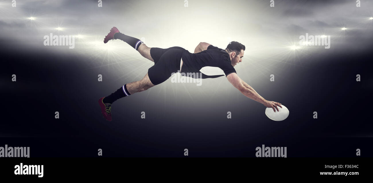 Composite image of rugby player scoring a try Stock Photo - Alamy