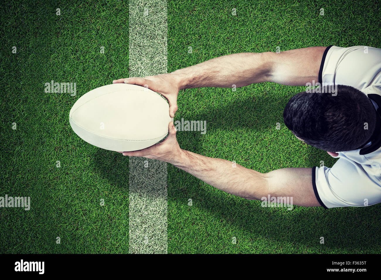 Man holding ball hands hi-res stock photography and images - Alamy
