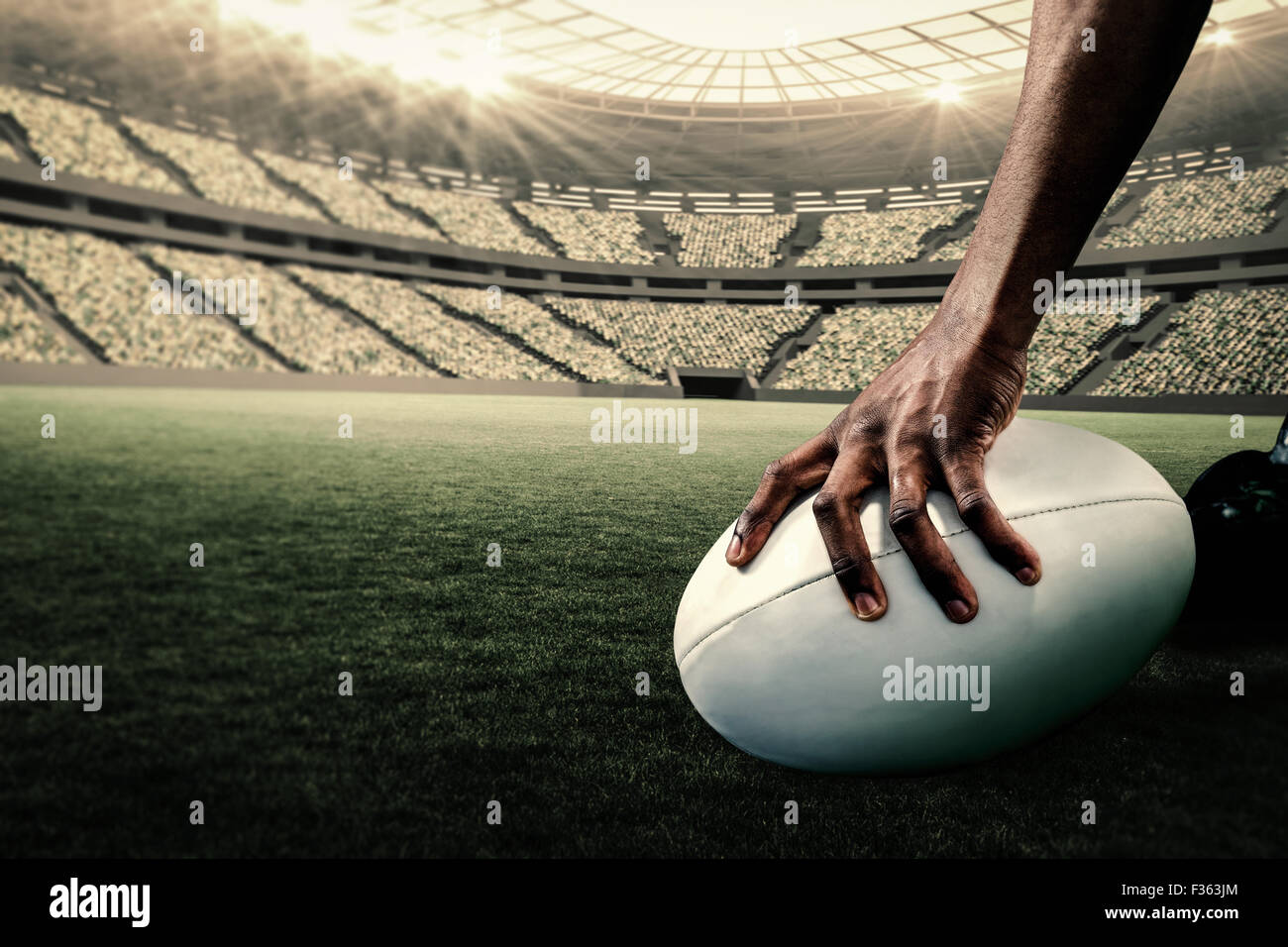 Composite image of cropped image of athlete holding rugby ball Stock ...