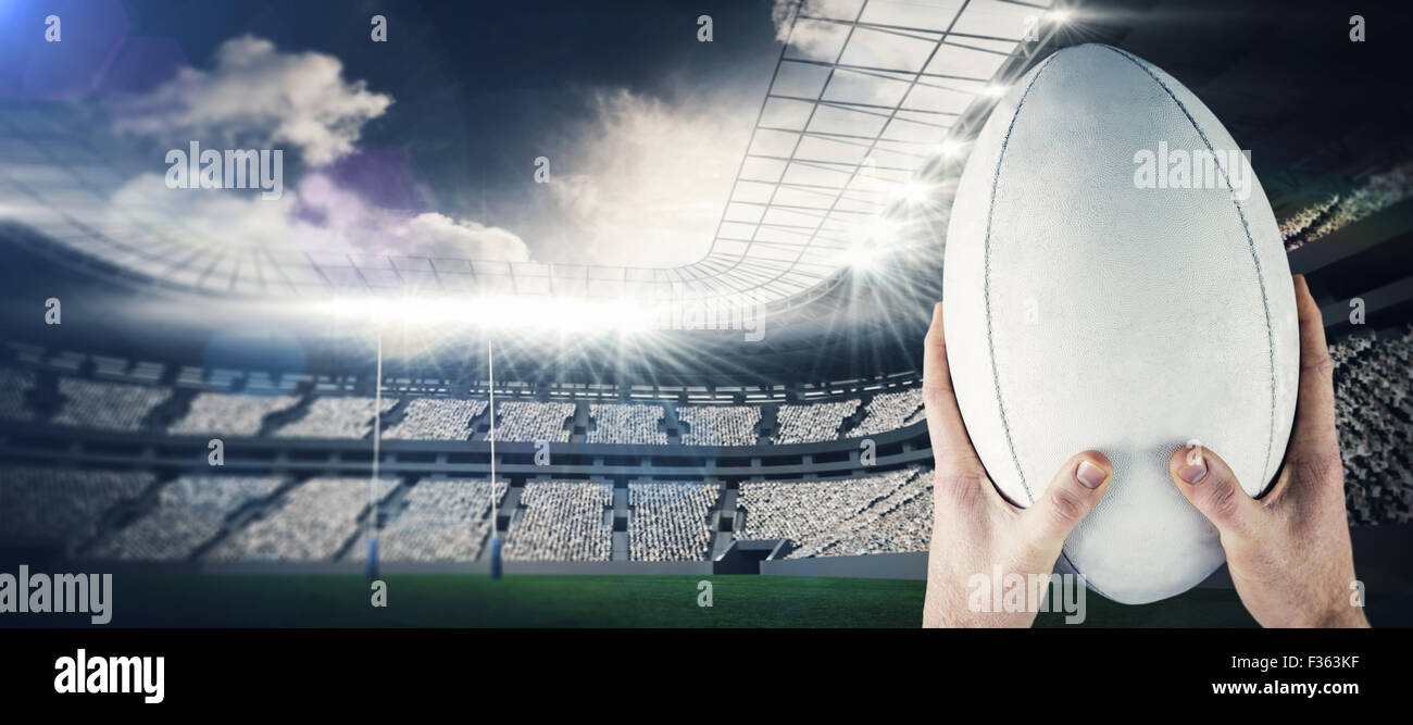 Composite image of rugby player catching a rugby ball Stock Photo - Alamy