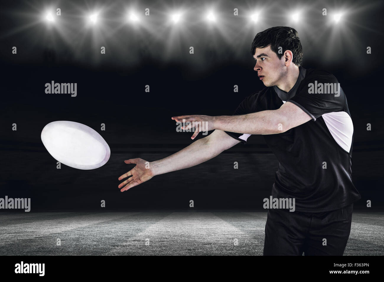 Composite image of rugby player doing a side pass Stock Photo - Alamy