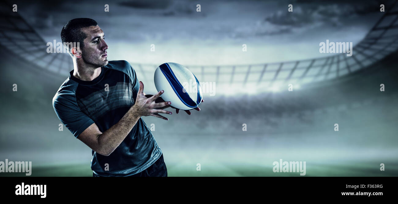 Composite image of sports player catching the ball Stock Photo - Alamy