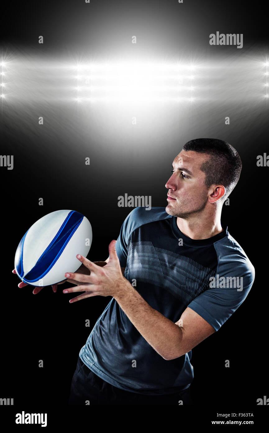 Composite image of sports player catching the ball Stock Photo - Alamy