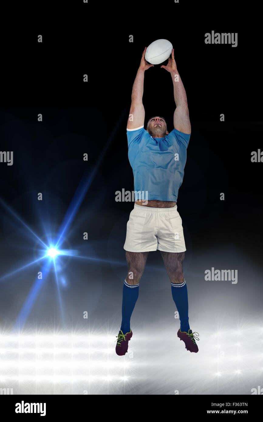 Composite image of rugby player catching the ball Stock Photo - Alamy