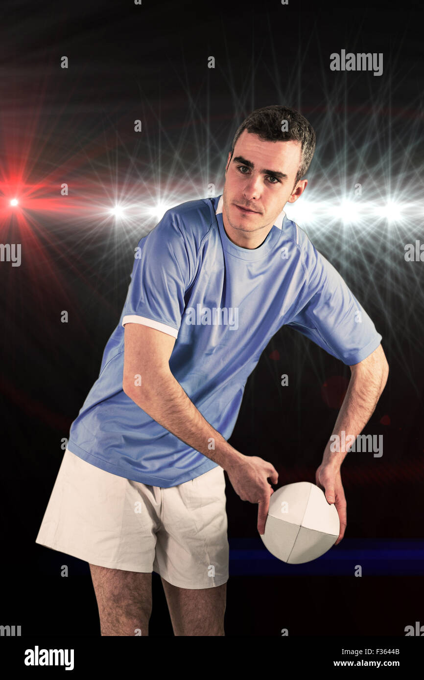 Composite image of rugby player about to throw a rugby ball Stock Photo ...