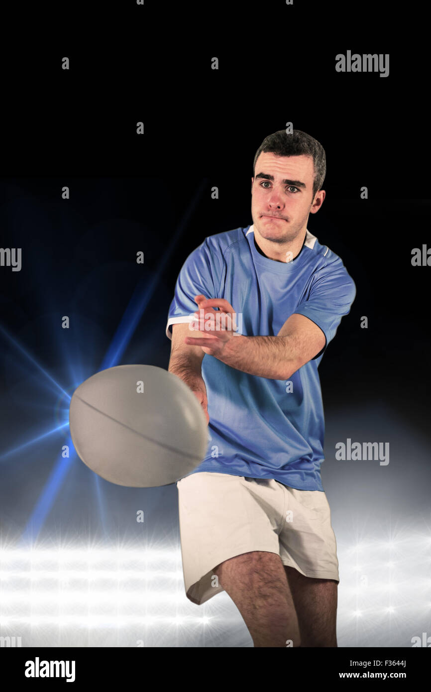Composite image of rugby player throwing a rugby ball Stock Photo - Alamy
