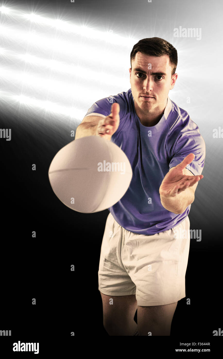 Composite image of rugby player catching a rugby ball Stock Photo - Alamy