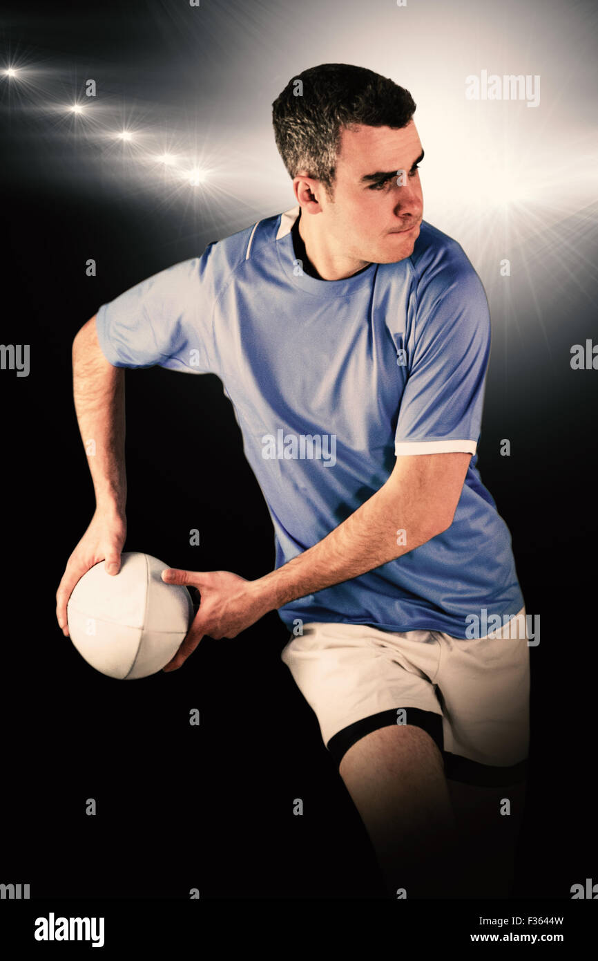 Composite image of rugby player doing a side pass Stock Photo - Alamy