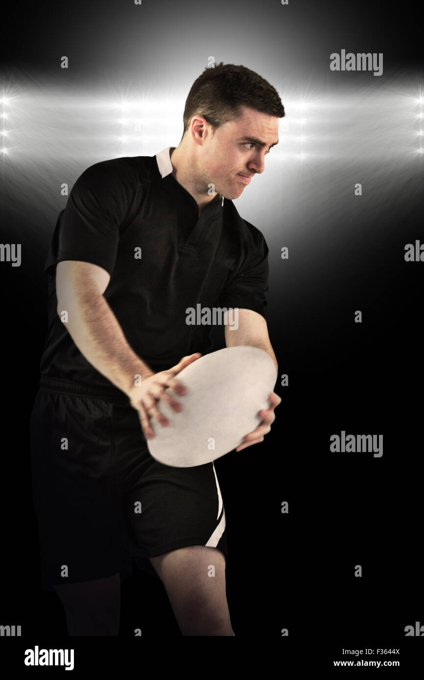 Composite image of rugby player doing a side pass Stock Photo - Alamy