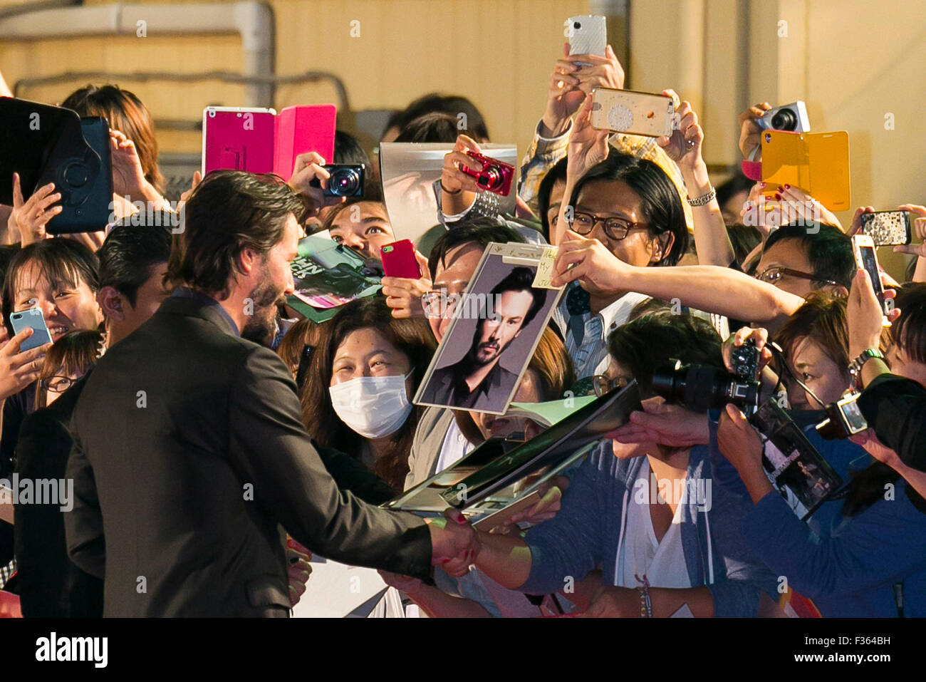Tokyo, Japan. 30th September, 2015. Canadian actor Keanu Reeves signs ...
