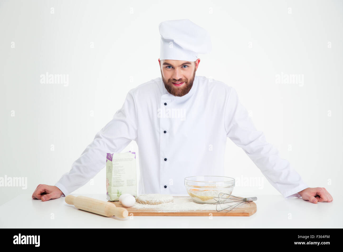 Portrait of a male baker standing isolated on a white background Stock ...