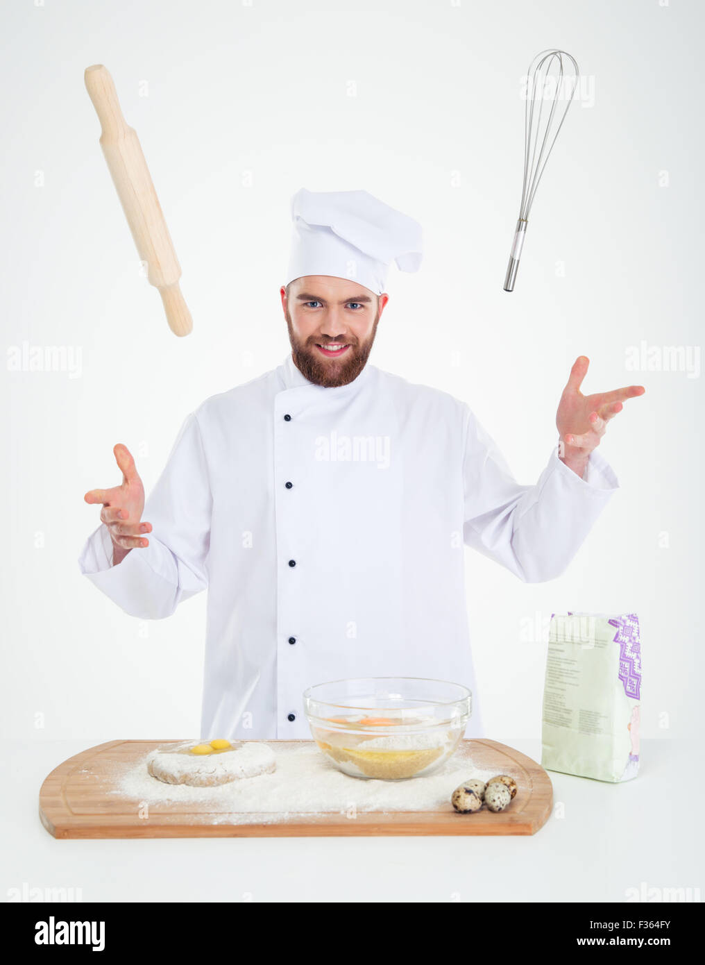 Portrait of a happy male chef cook baking isolated on a white ...