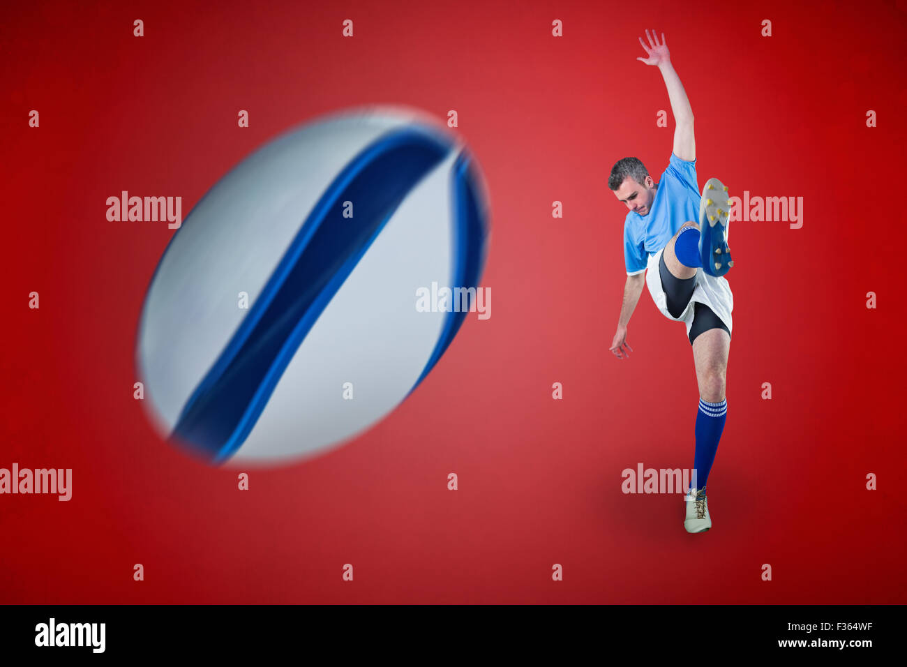 Composite image of rugby player kicking Stock Photo - Alamy
