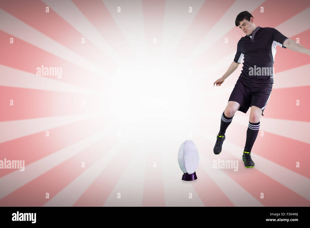 Composite image of rugby player doing a drop kick Stock Photo - Alamy
