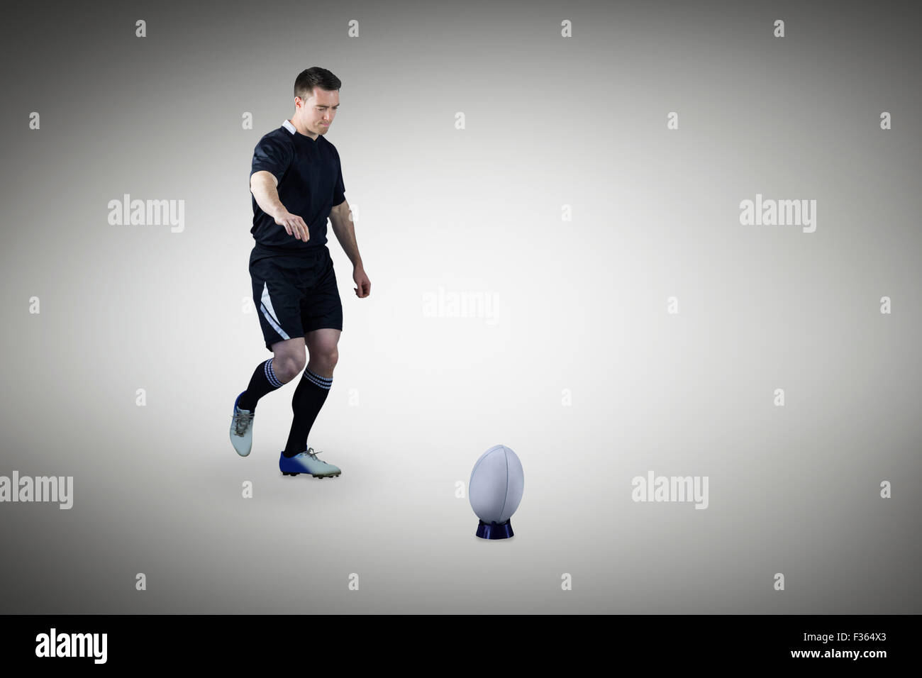 Composite image of rugby player doing a drop kick Stock Photo - Alamy