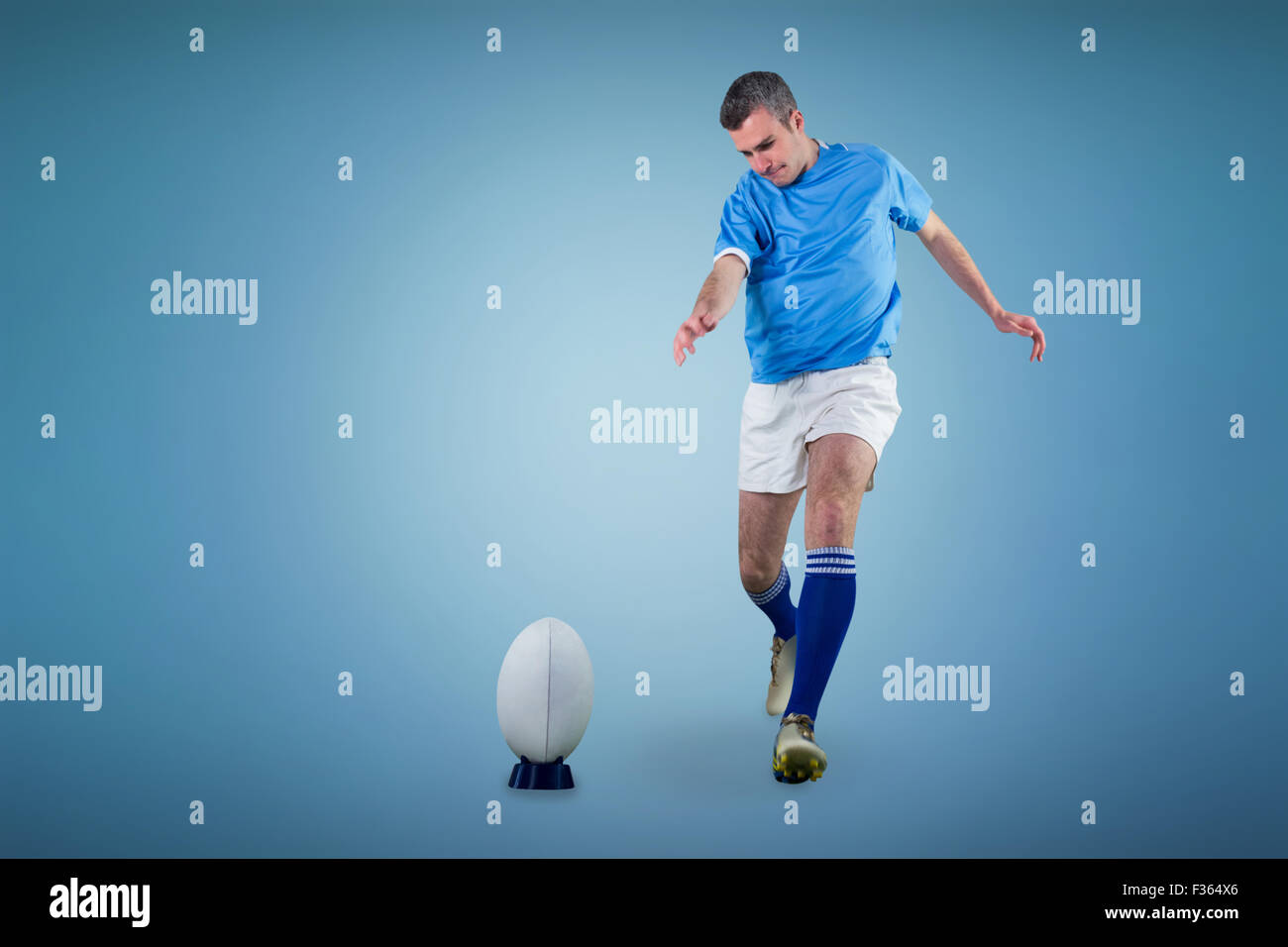 Composite image of rugby player doing a drop kick Stock Photo - Alamy