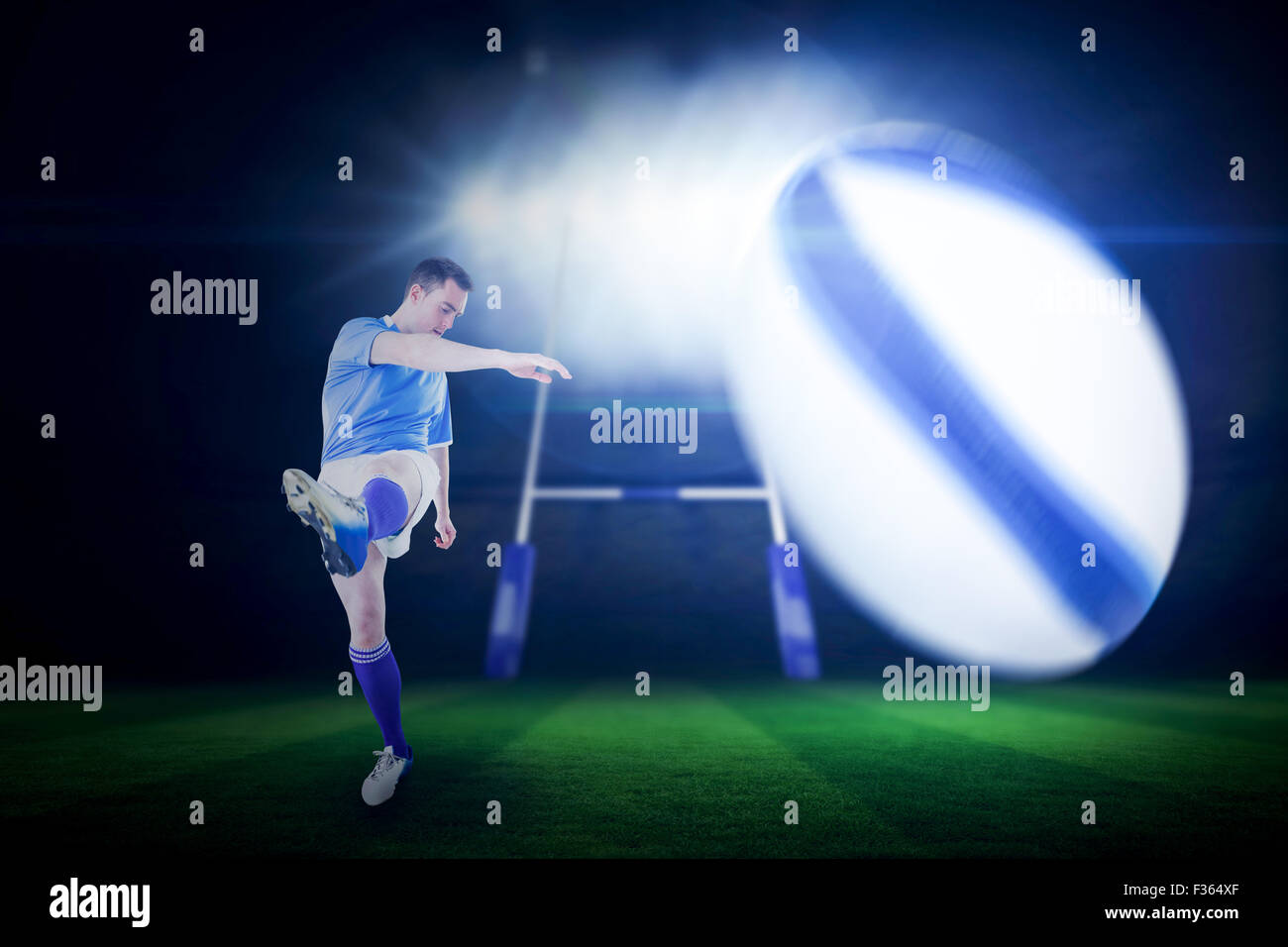 Composite image of rugby player kicking Stock Photo - Alamy