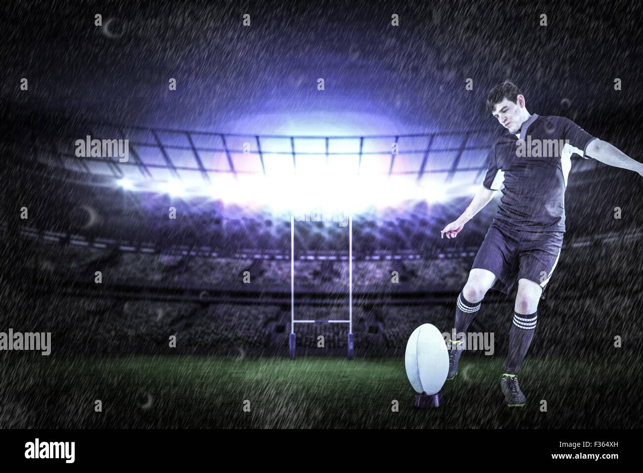 Composite image of rugby player doing a drop kick Stock Photo - Alamy