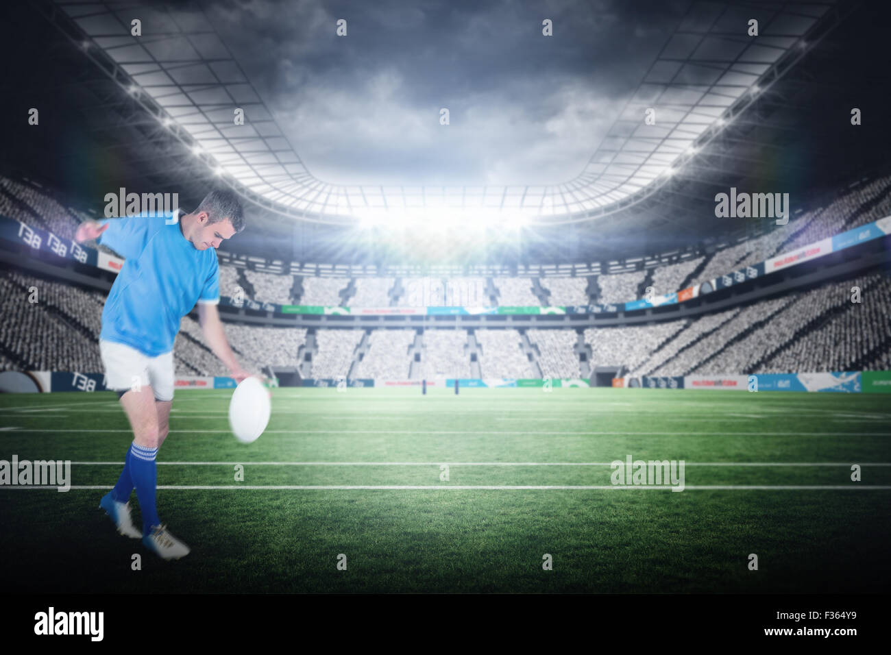 Young man kicking a ball hi-res stock photography and images - Alamy