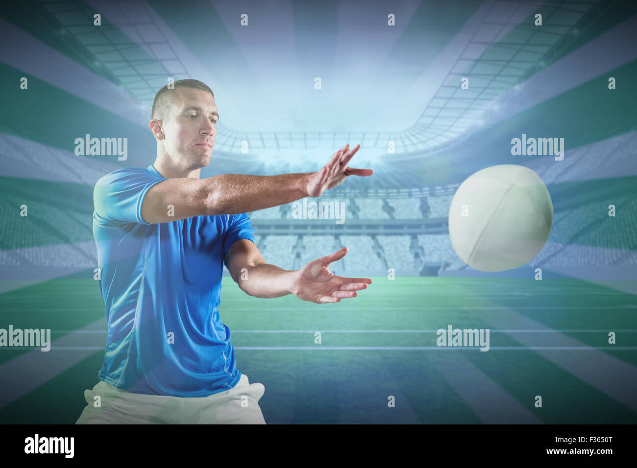 Composite image of rugby player catching the ball Stock Photo - Alamy