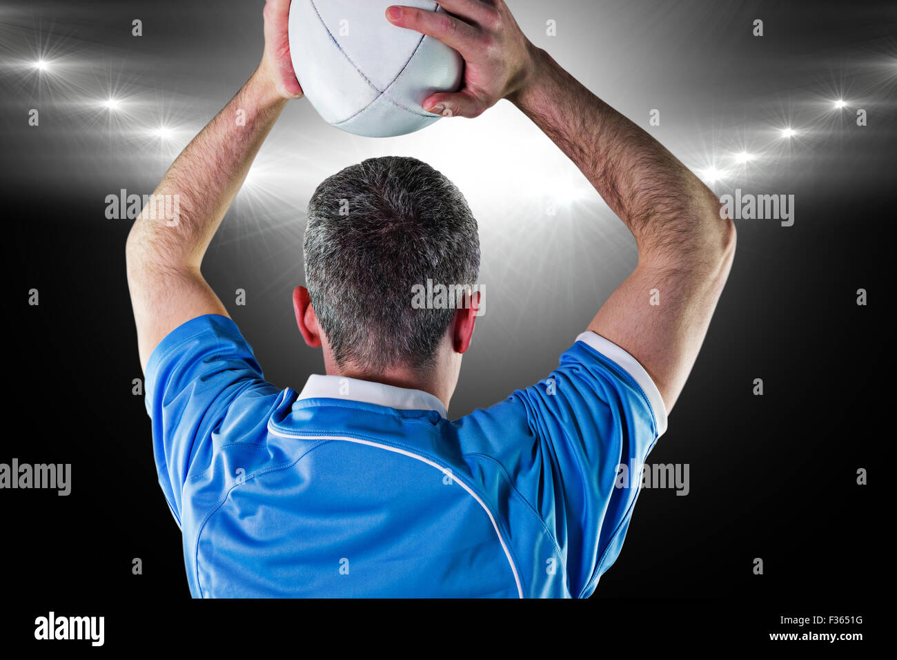 Composite image of rugby player about to throw a rugby ball Stock Photo ...