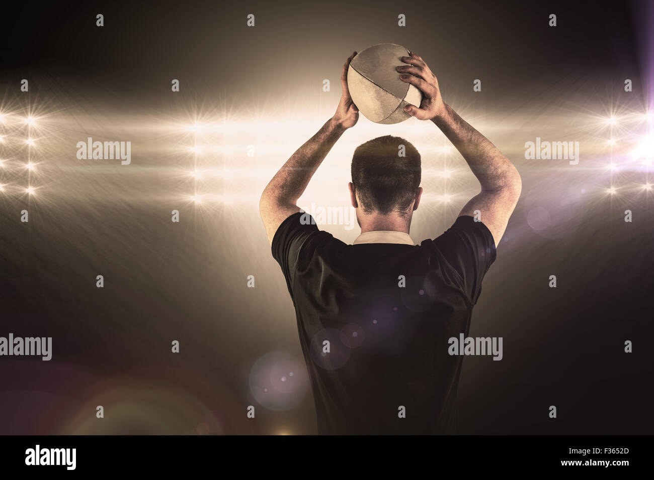 Composite image of rugby player about to throw a rugby ball Stock Photo ...