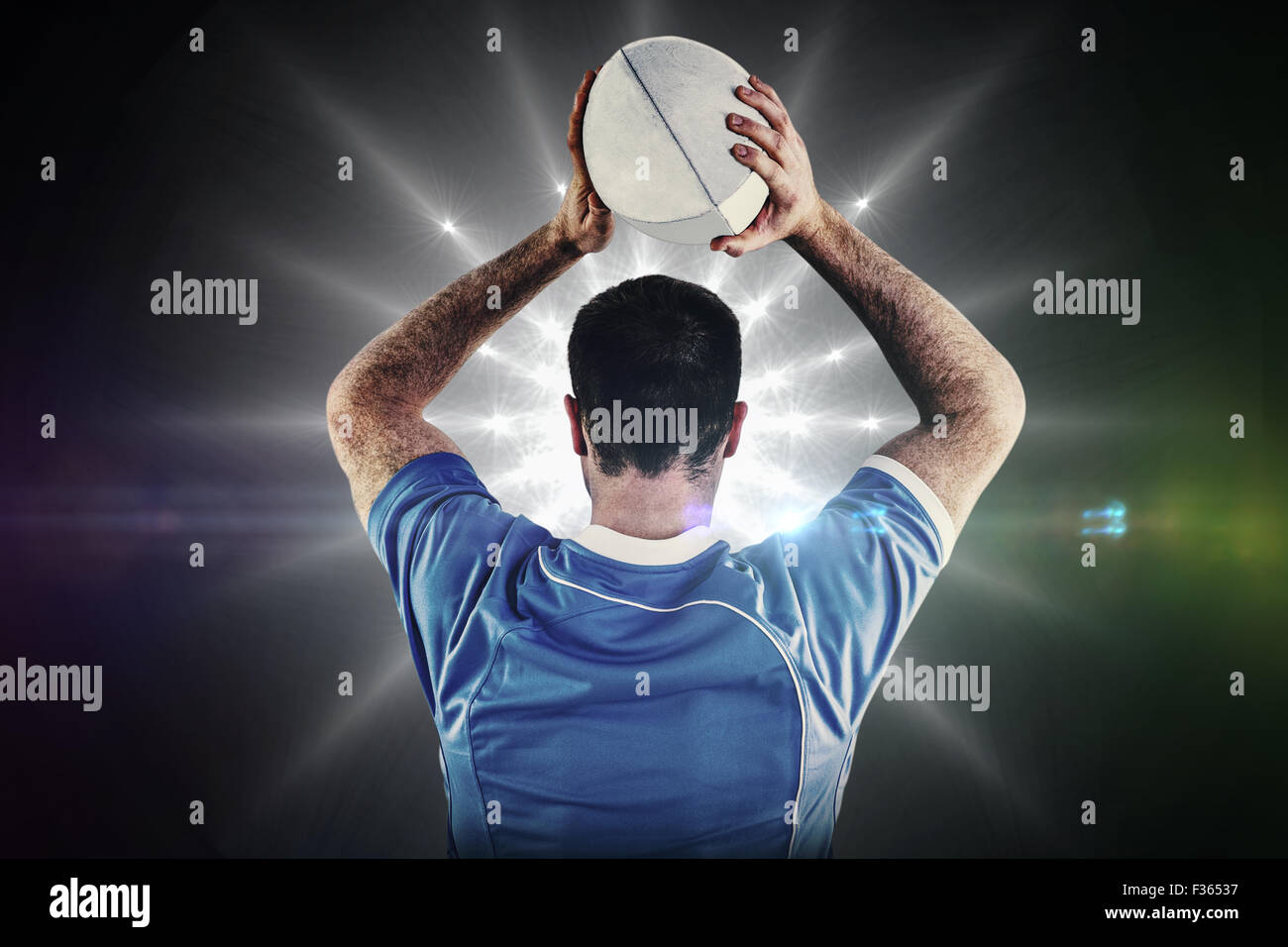 Composite image of rugby player about to throw a rugby ball Stock Photo ...